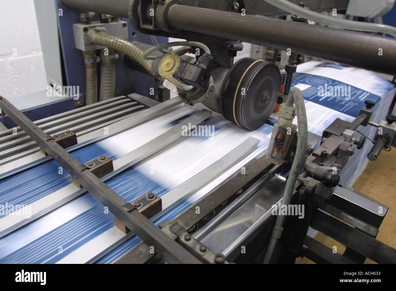 Printing industry folding machine Stock Photo - Alamy