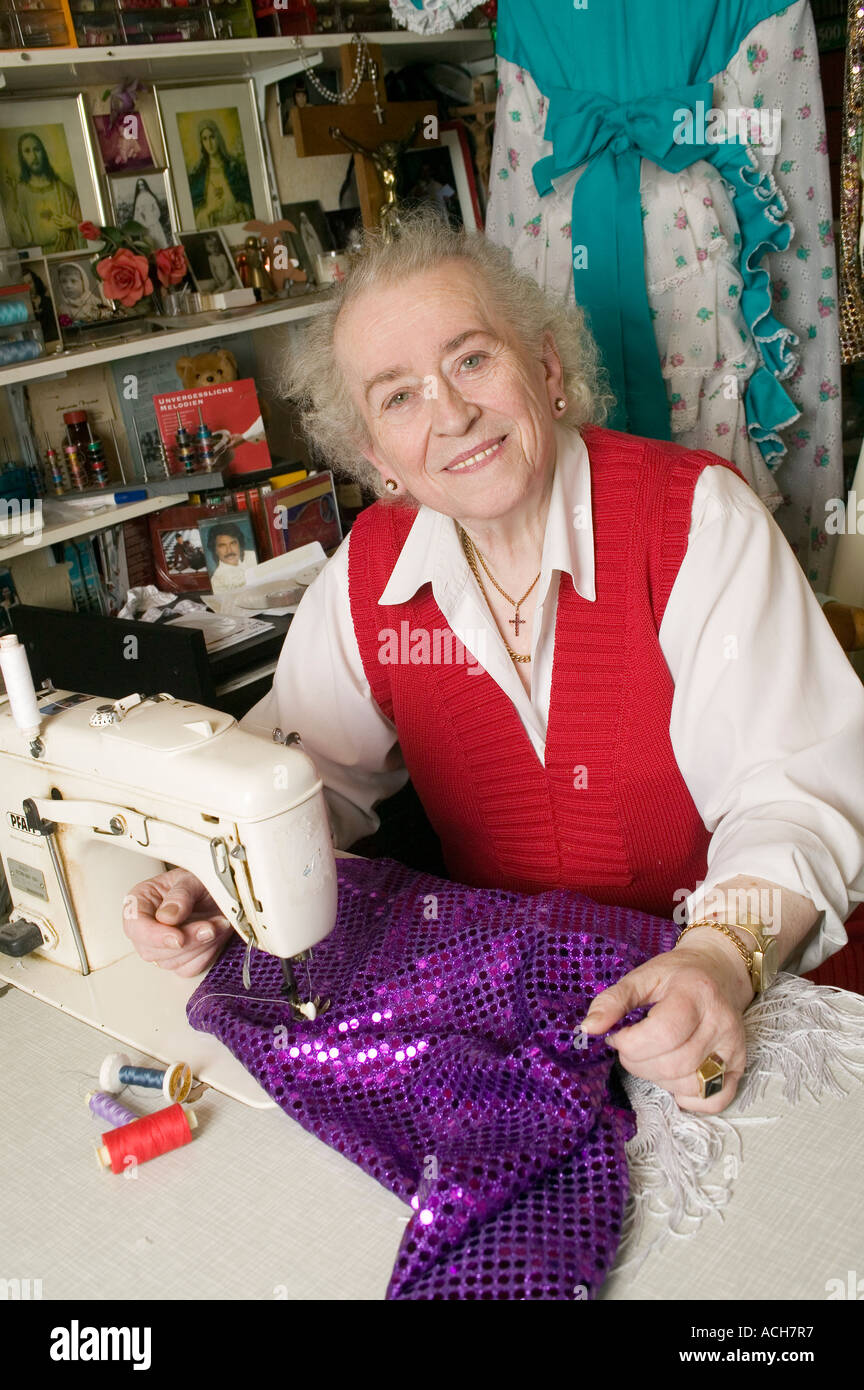 Portrait of over 80 years old woman still working as a tailor Stock ...