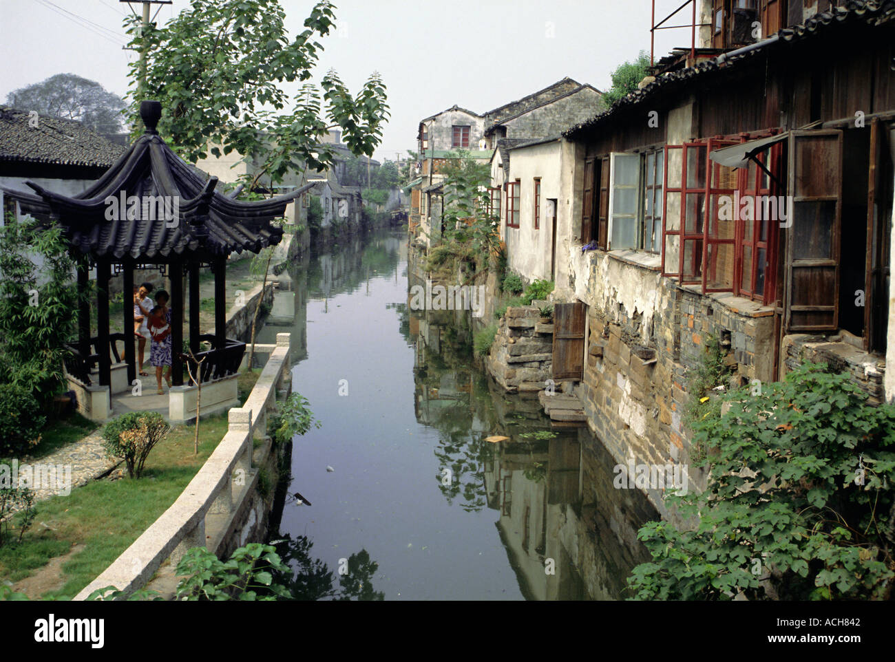 Venice of the East one of the many canals still in use lined with ...
