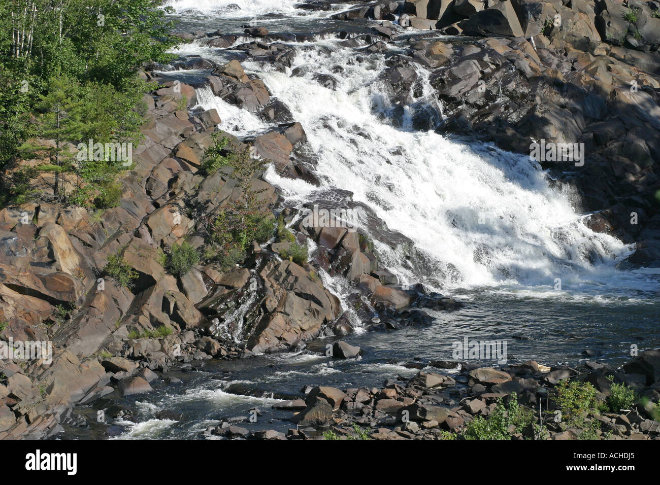 river rapids across rocky incline Stock Photo - Alamy