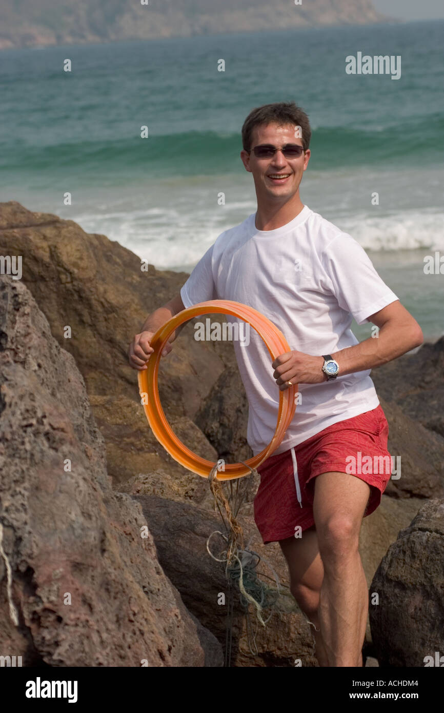 male volunteer at Coastal Clean Up Day Beach Clean Up Dai Long Wan Hong ...
