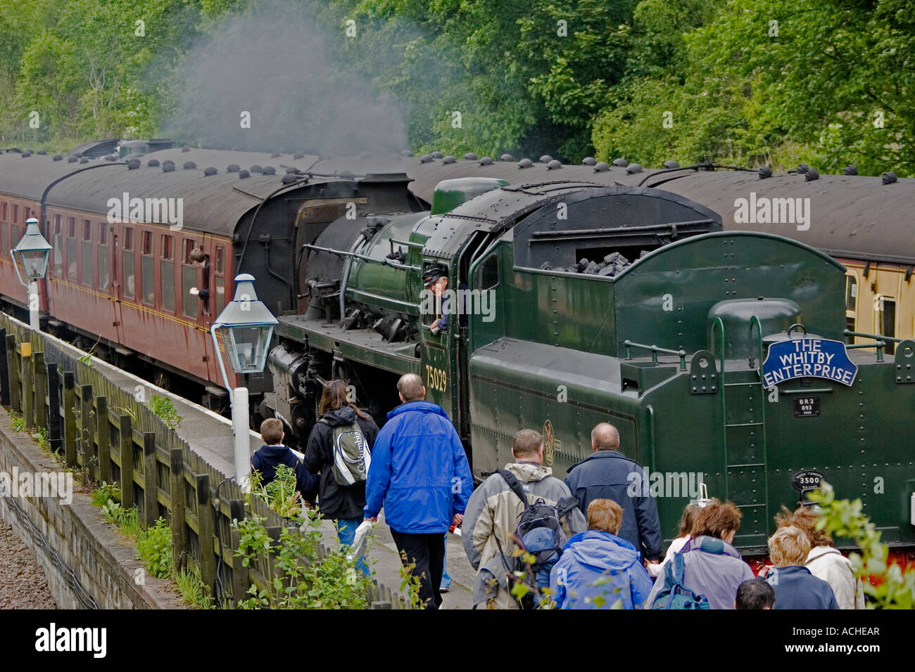 Tourists go to board the Whitby Enterprise steam train at Grosmont ...