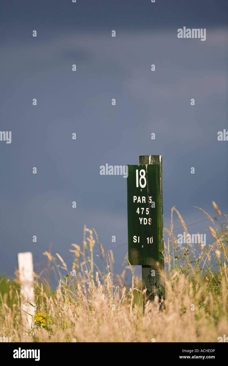 Golf course green sign post with stormy background Stock Photo - Alamy