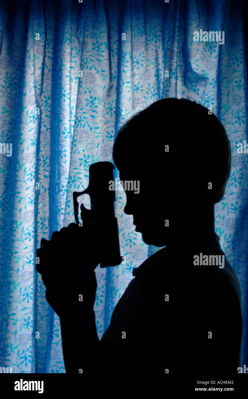 Boy Posing As 007 Stock Photo - Alamy