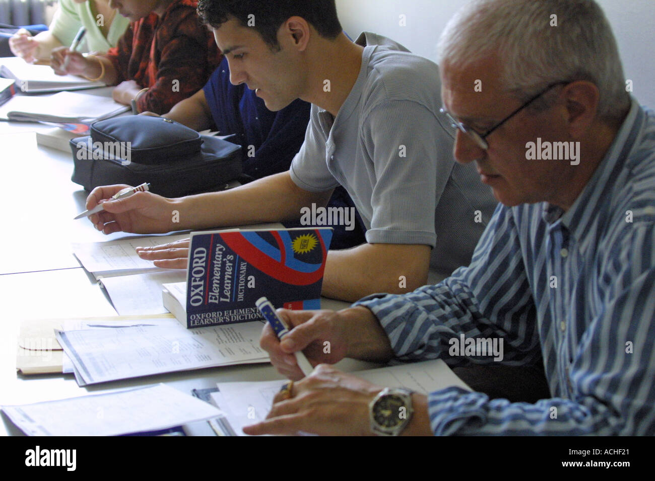 Mature male students ESOL class at London college Stock Photo - Alamy
