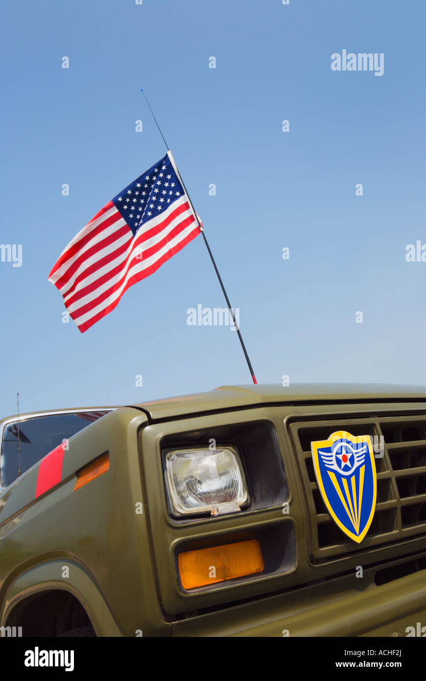 An American Ford pick up in military Colors and an American flag Stock ...