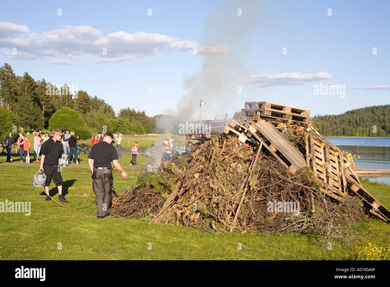 setting fire to the midsummer pyre, Sotkamo Finland Stock Photo - Alamy
