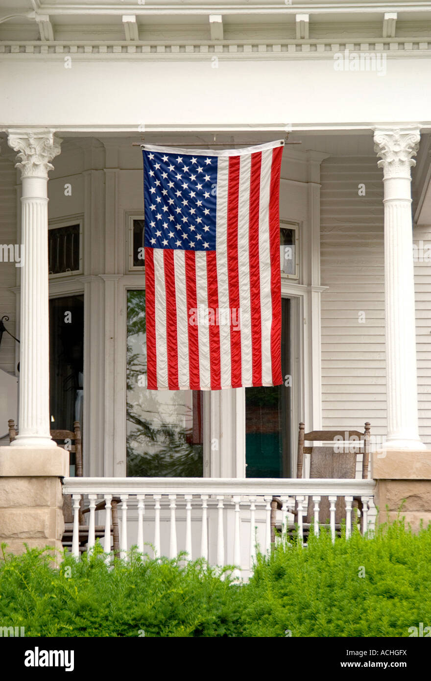 Victorian Porch, American Flag & Rocking Chair on Main Street USA Stock ...