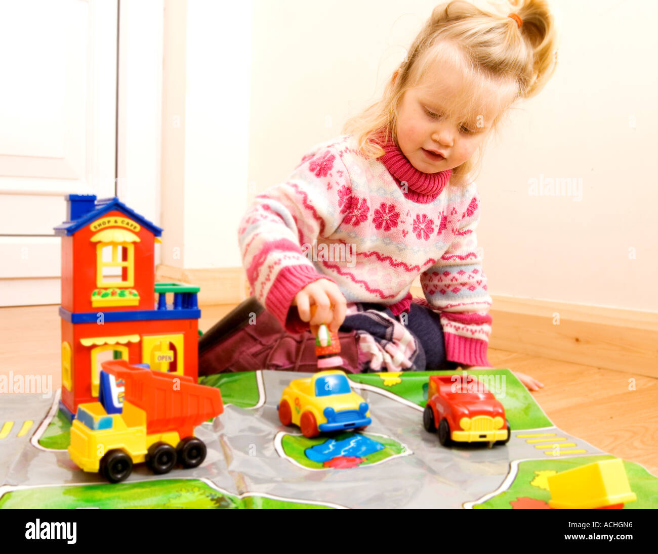 Girl playing cars toys hi-res stock photography and images - Alamy