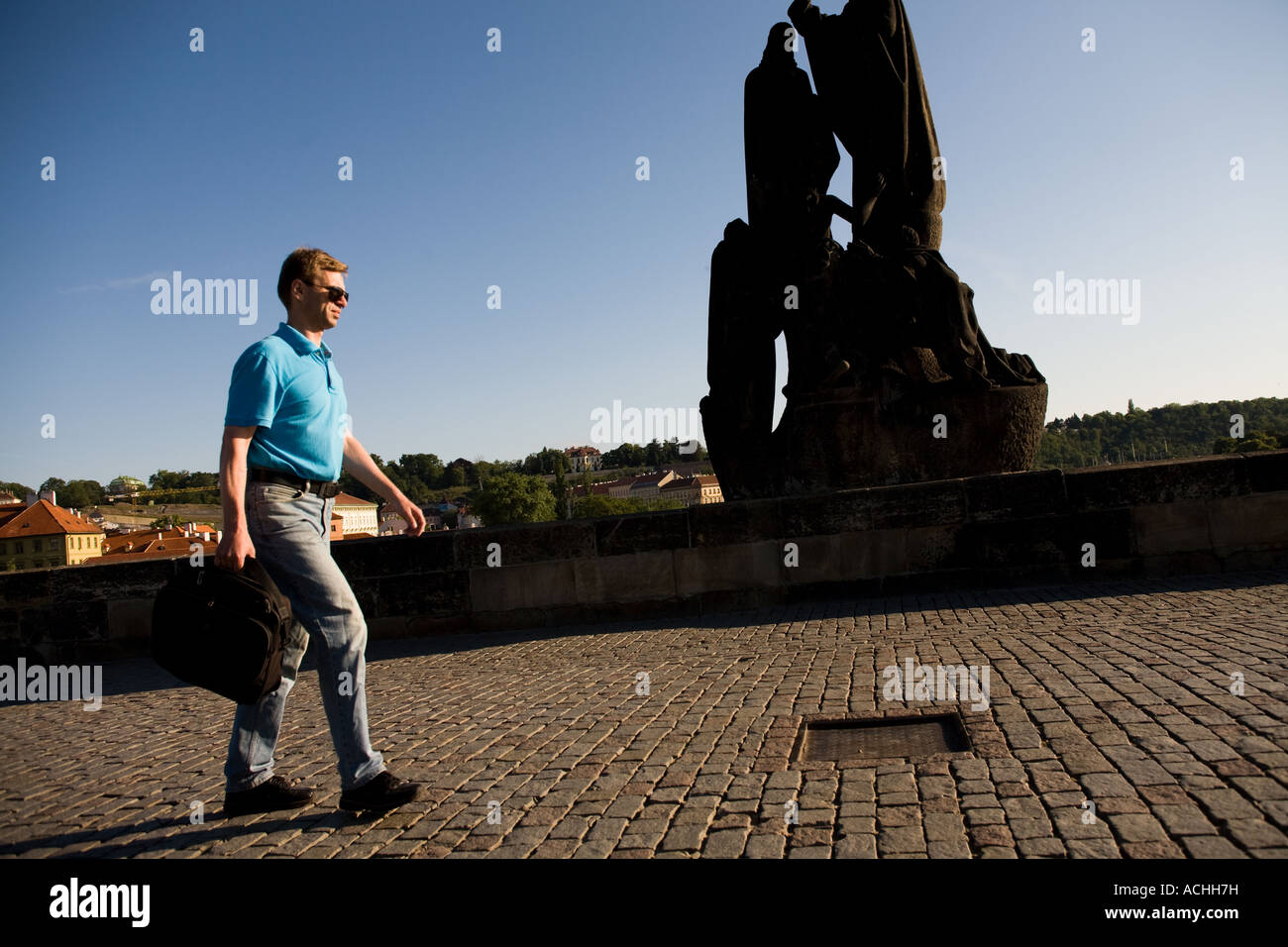 Man crossing Charles bridge Stock Photo - Alamy
