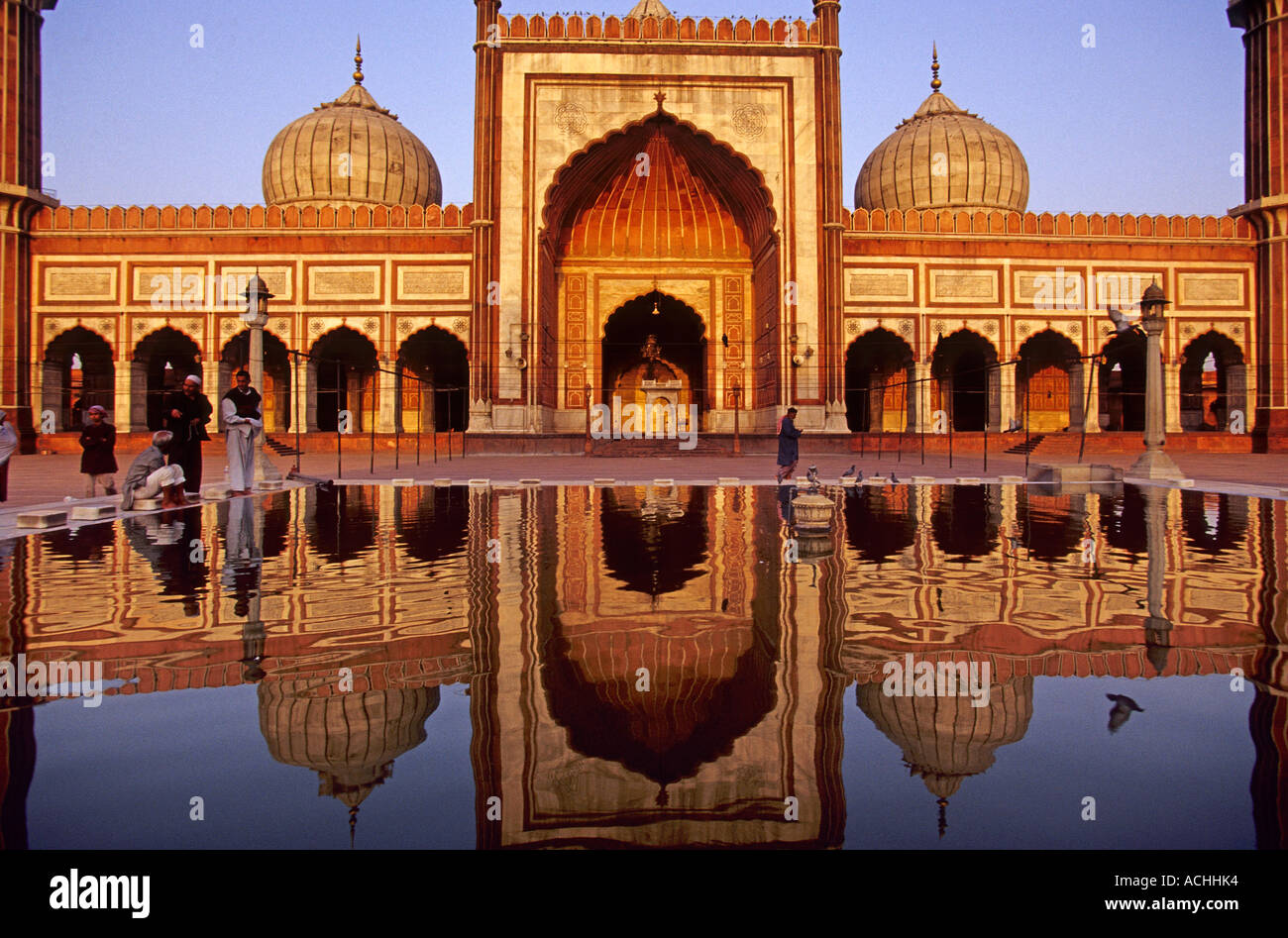 Jama Masjid mosque in Delhi with faithful mirroring in the morning ...
