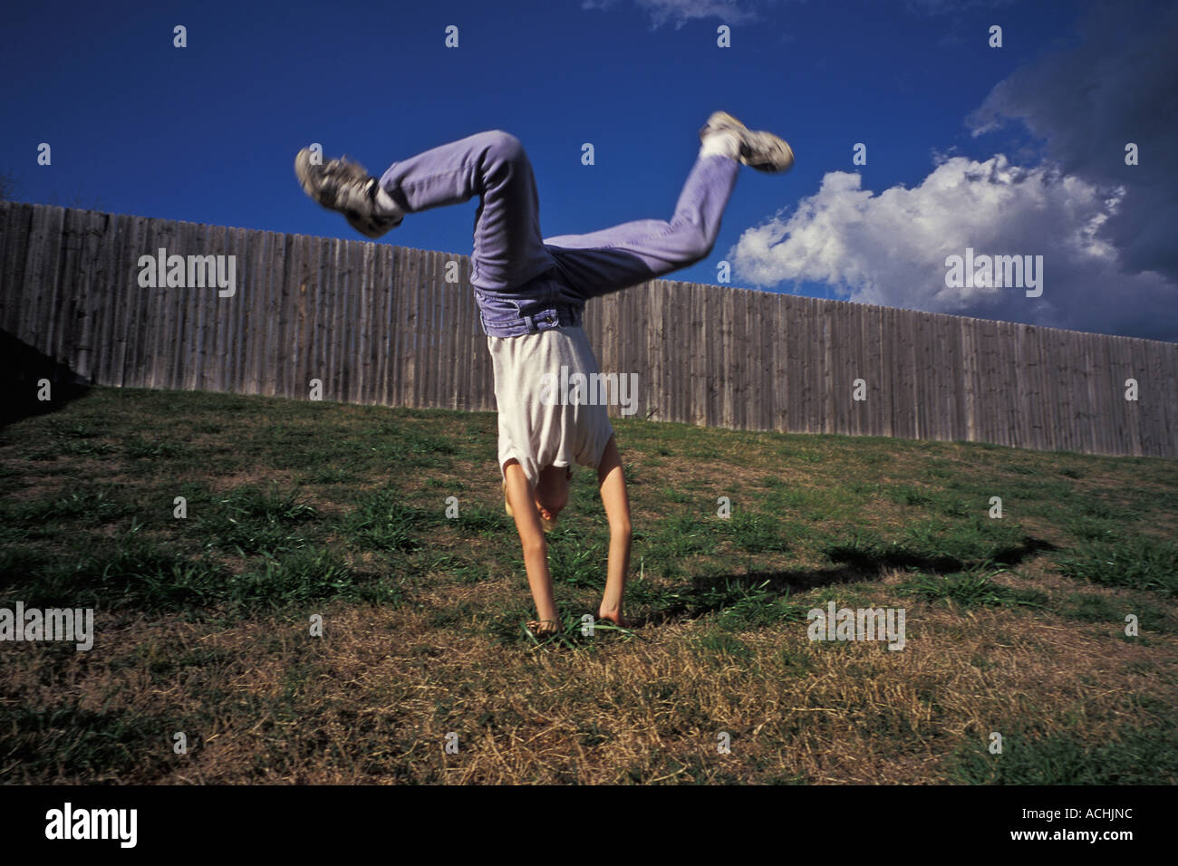 Girl turning cartwheel hi-res stock photography and images - Alamy