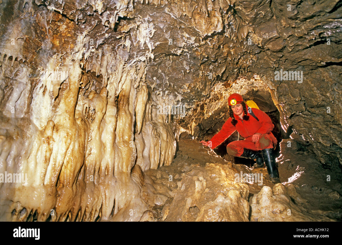 Female caver with flowstone formations Mendip Somerset England UK Stock ...