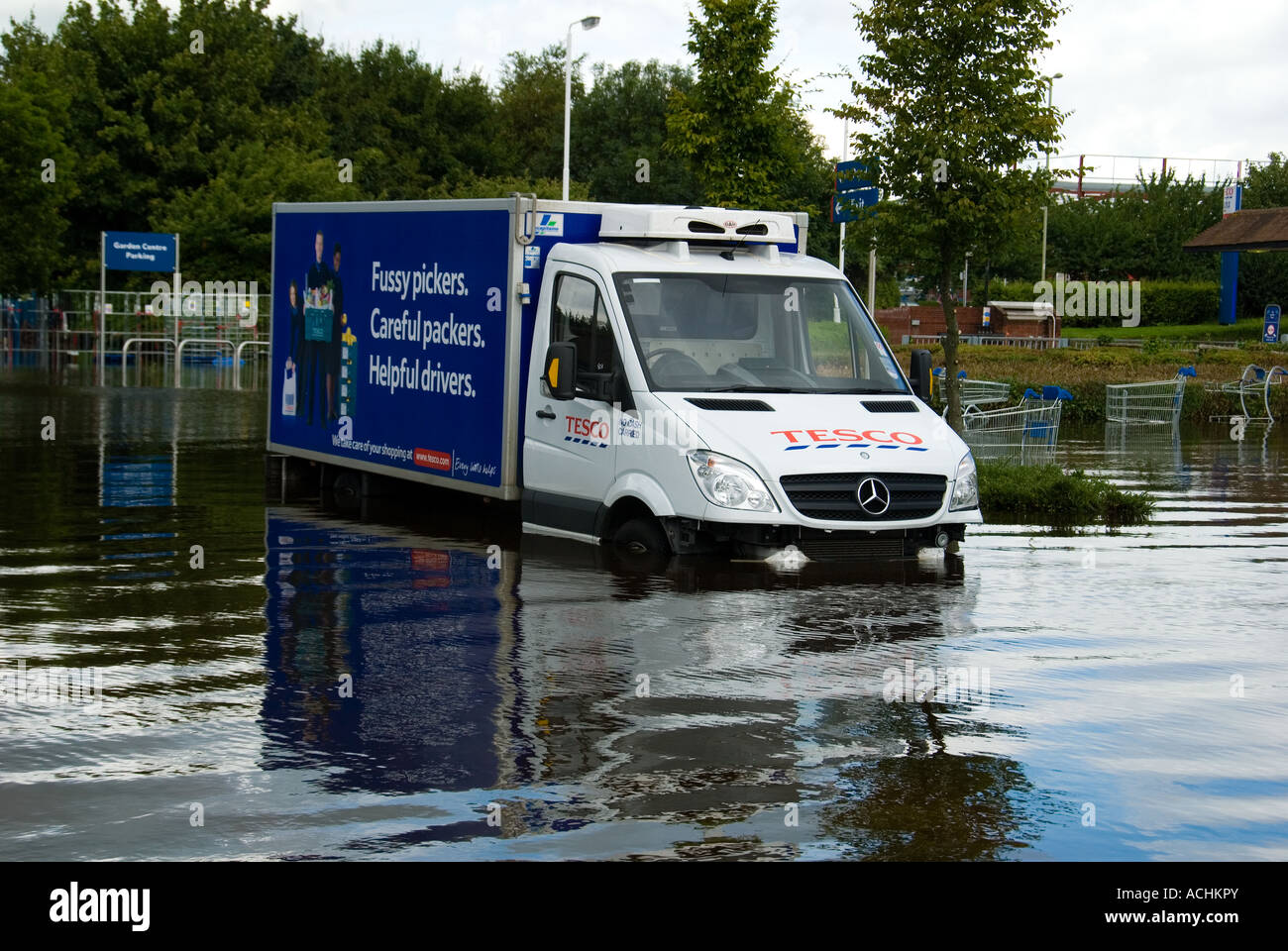 An Abandoned Delivery Van in a Flooded Supermarket Car Park Stock Photo ...
