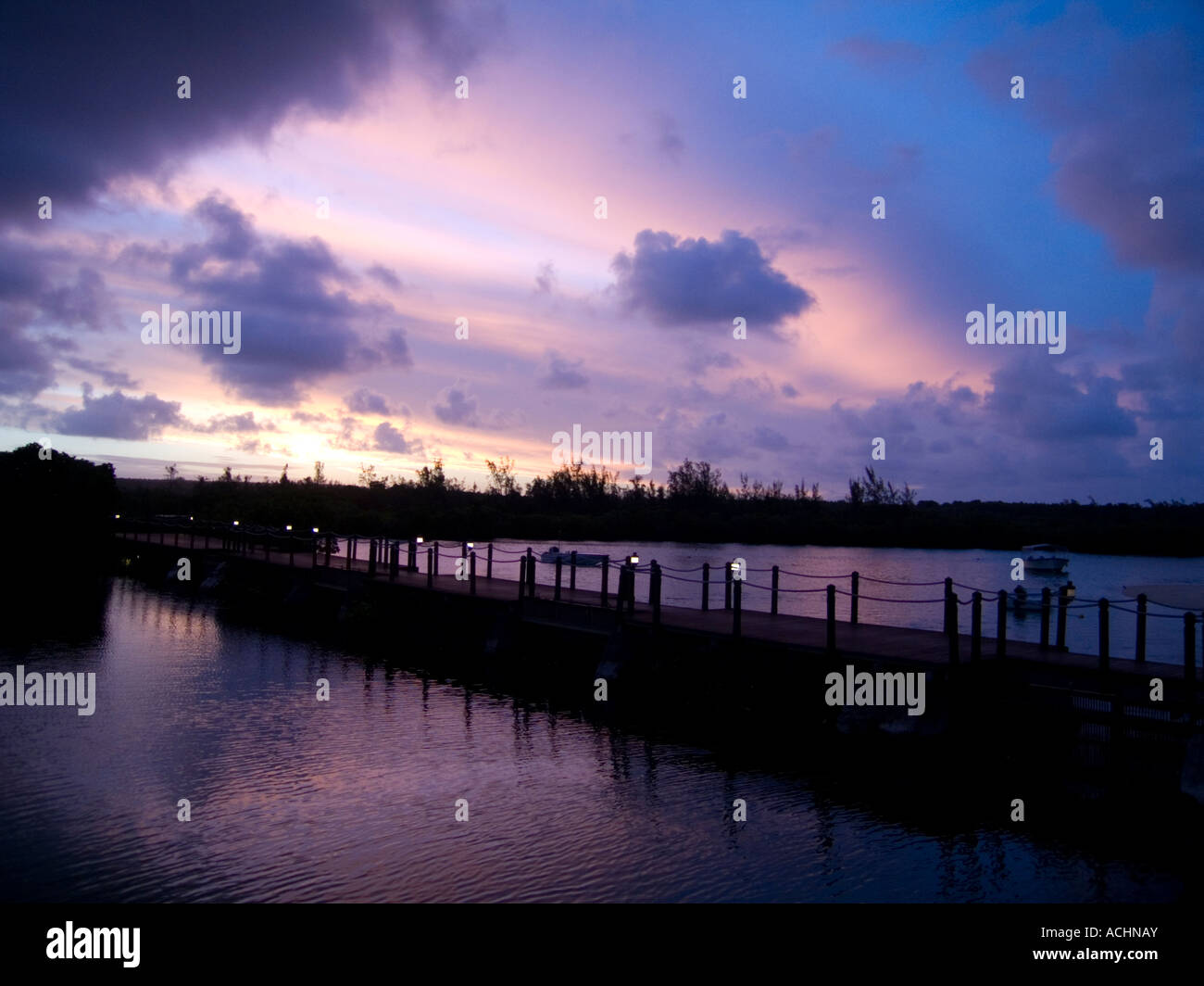 Cloud formation at sunset over walkway at Le Prince Maurice Resort ...