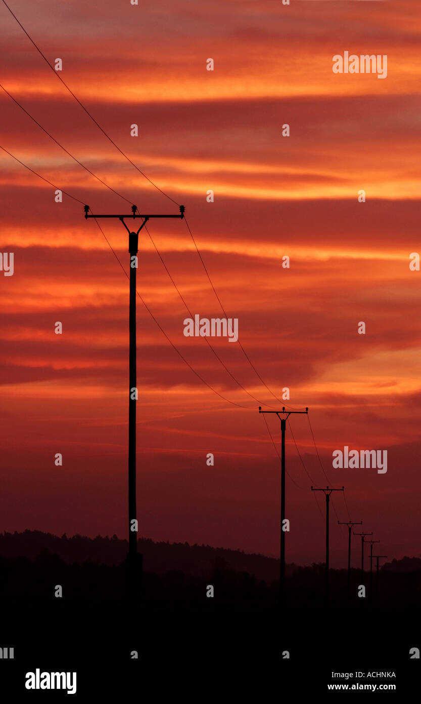 Power pole with power lines in the sunset Stock Photo - Alamy