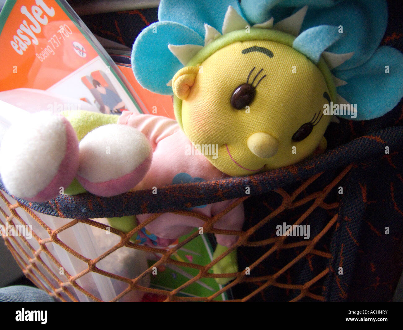 fifi toy in the seat storage on an aeroplane Stock Photo - Alamy
