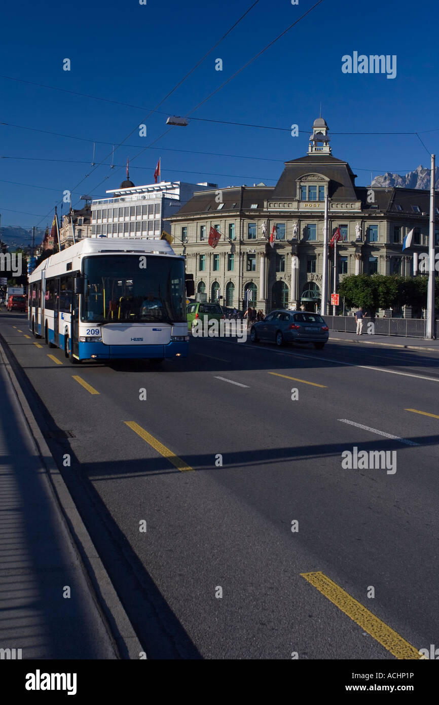 Trolleybus passing in front of main post office, Lucerne, Switzerland ...