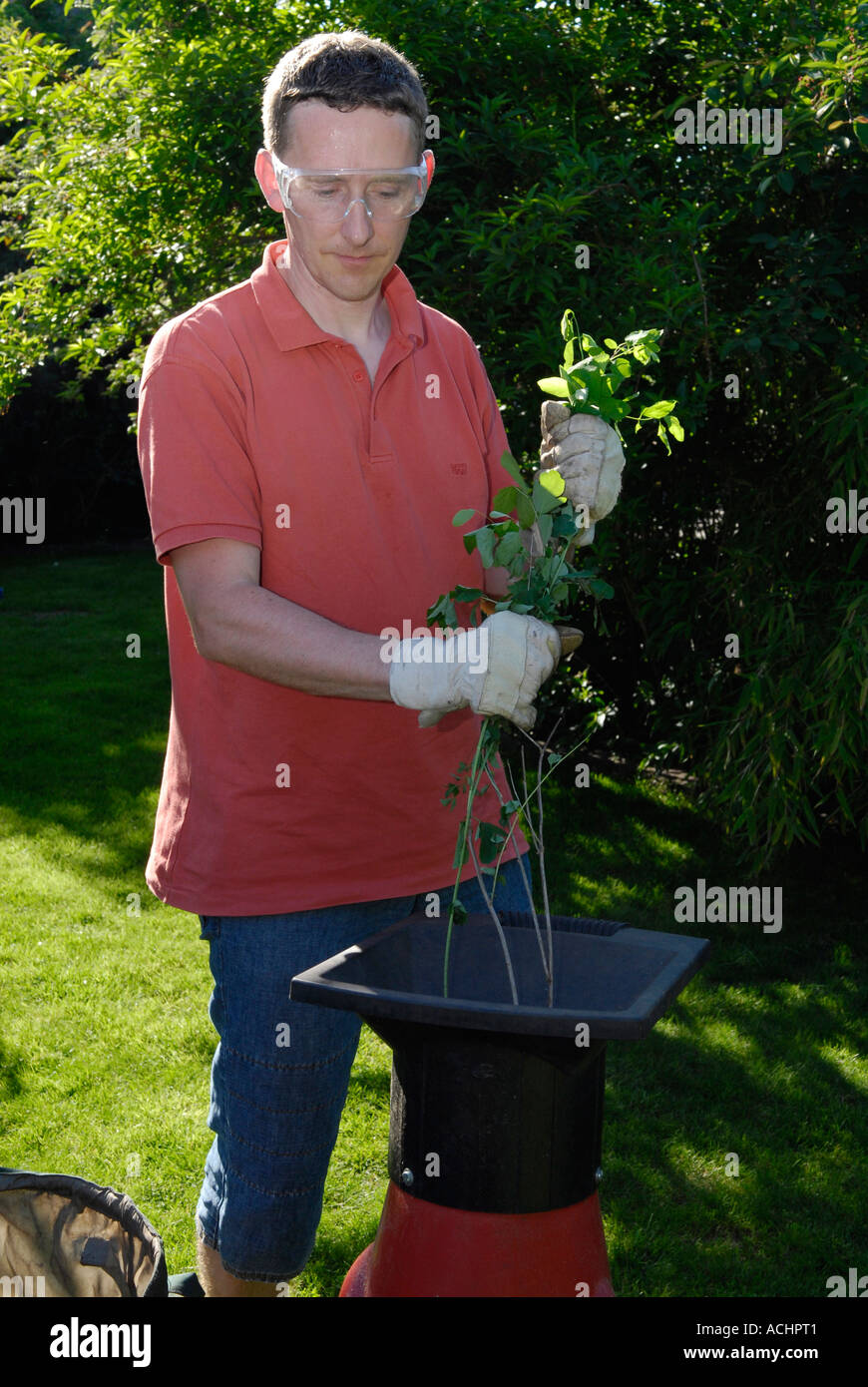 Man cuts up garden wastes hi-res stock photography and images - Alamy