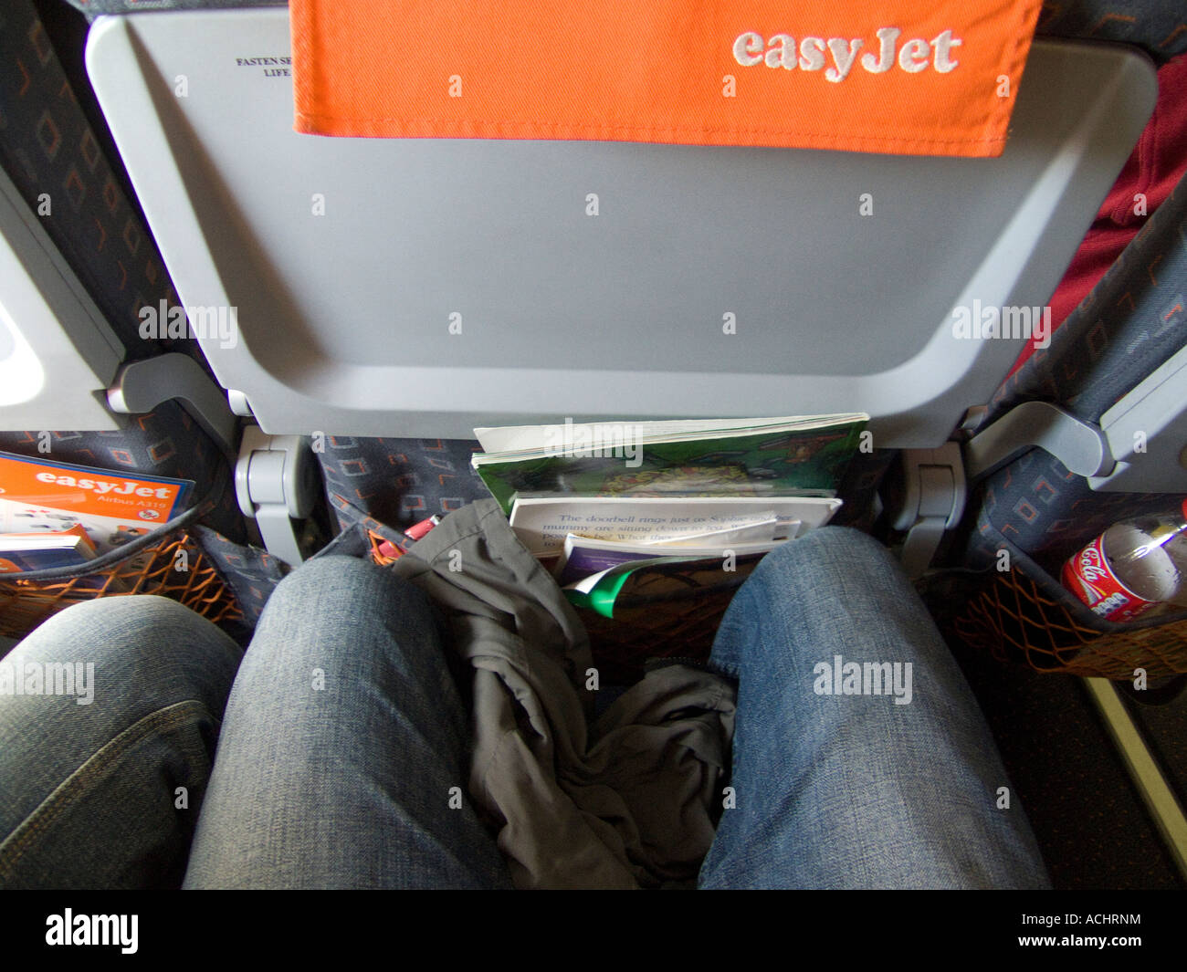 Leg room on a budget flight Stock Photo - Alamy