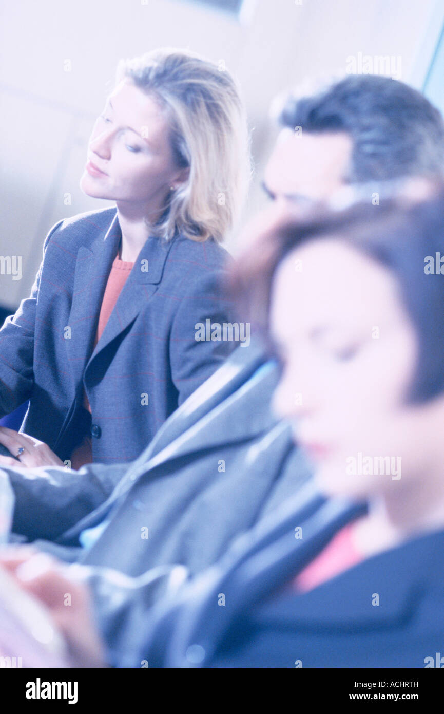 2 men and a man seated taking notes Stock Photo - Alamy
