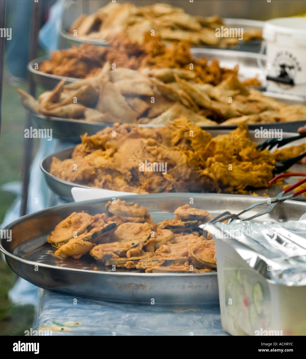Display of meats and samosas in metal plates at outdoors buffet Stock ...