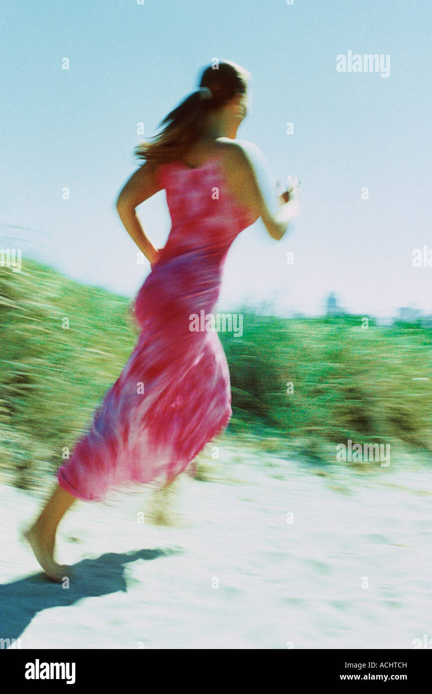 Woman dress running summer rear view hi-res stock photography and ...
