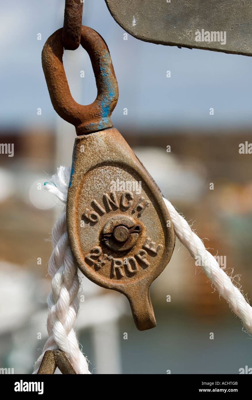 Rusty metal block and pulley Stock Photo - Alamy