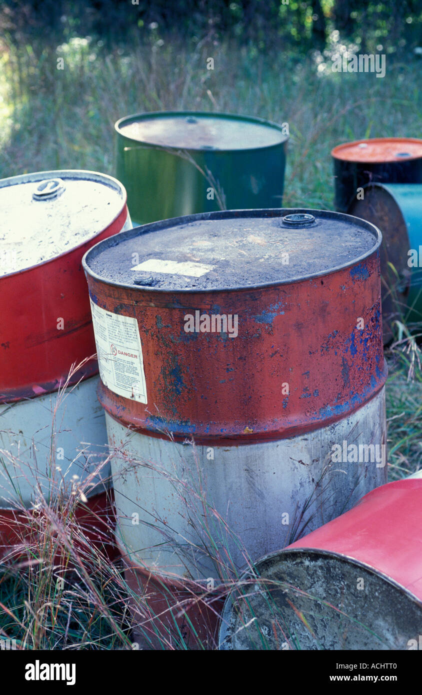 Barrels of industrial waste abandoned in a meadow Stock Photo - Alamy