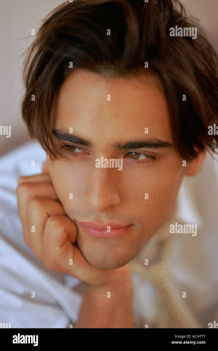 Portrait man smiling brown eyes looking dreamy Stock Photo - Alamy