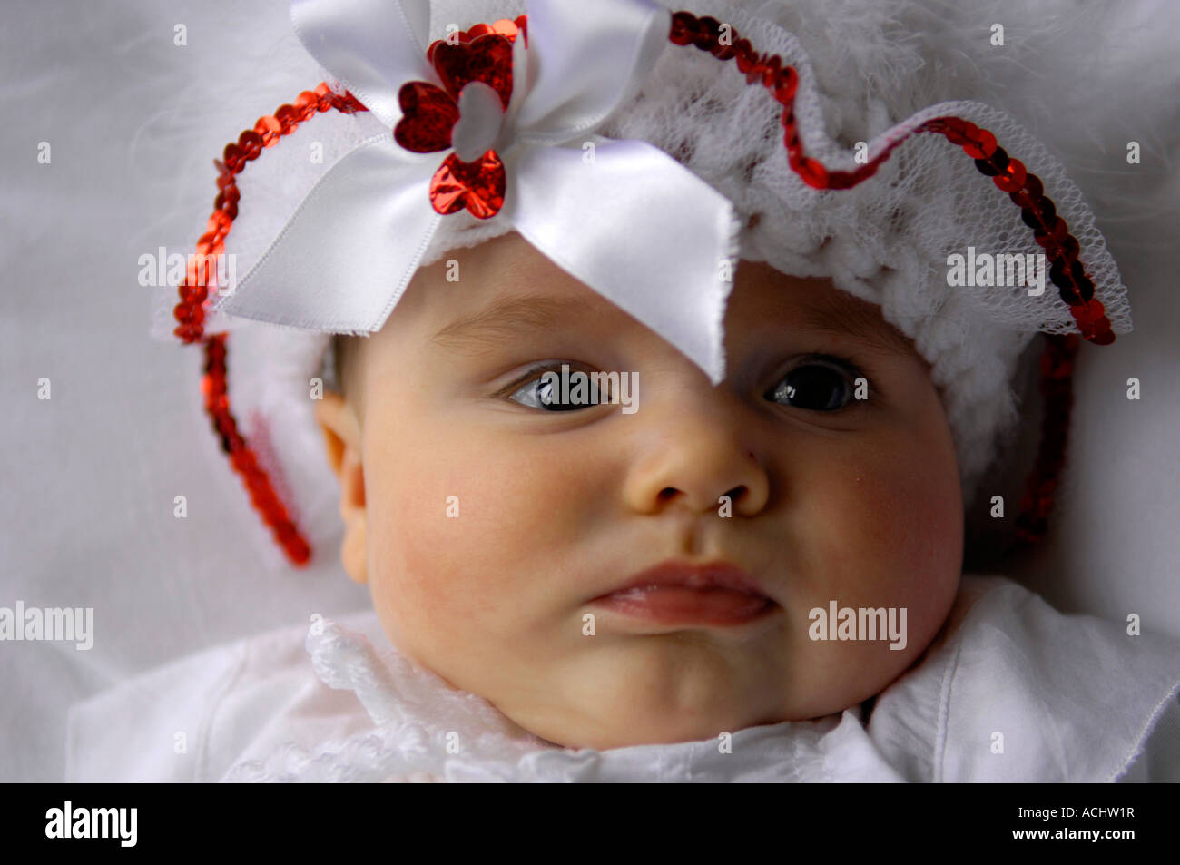 baby bonnet hat white red portrait face child infant colour color cute ...