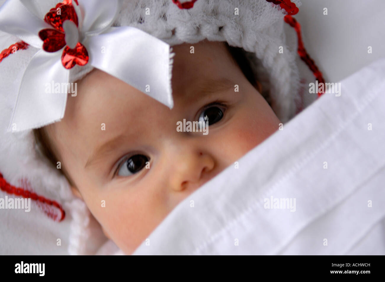 baby bonnet hat white red portrait face child infant colour color cute ...