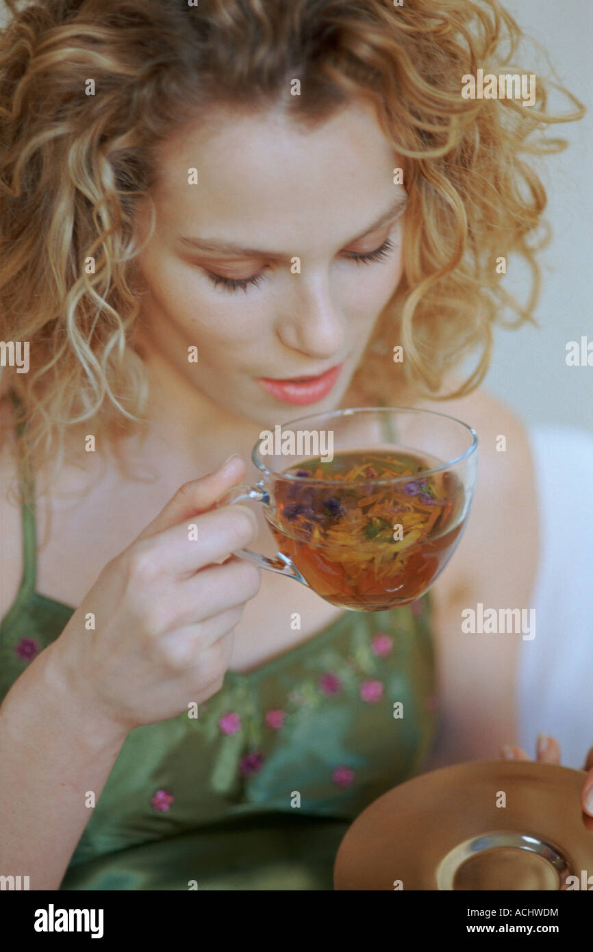Portrait blond woman dinking tea Stock Photo - Alamy