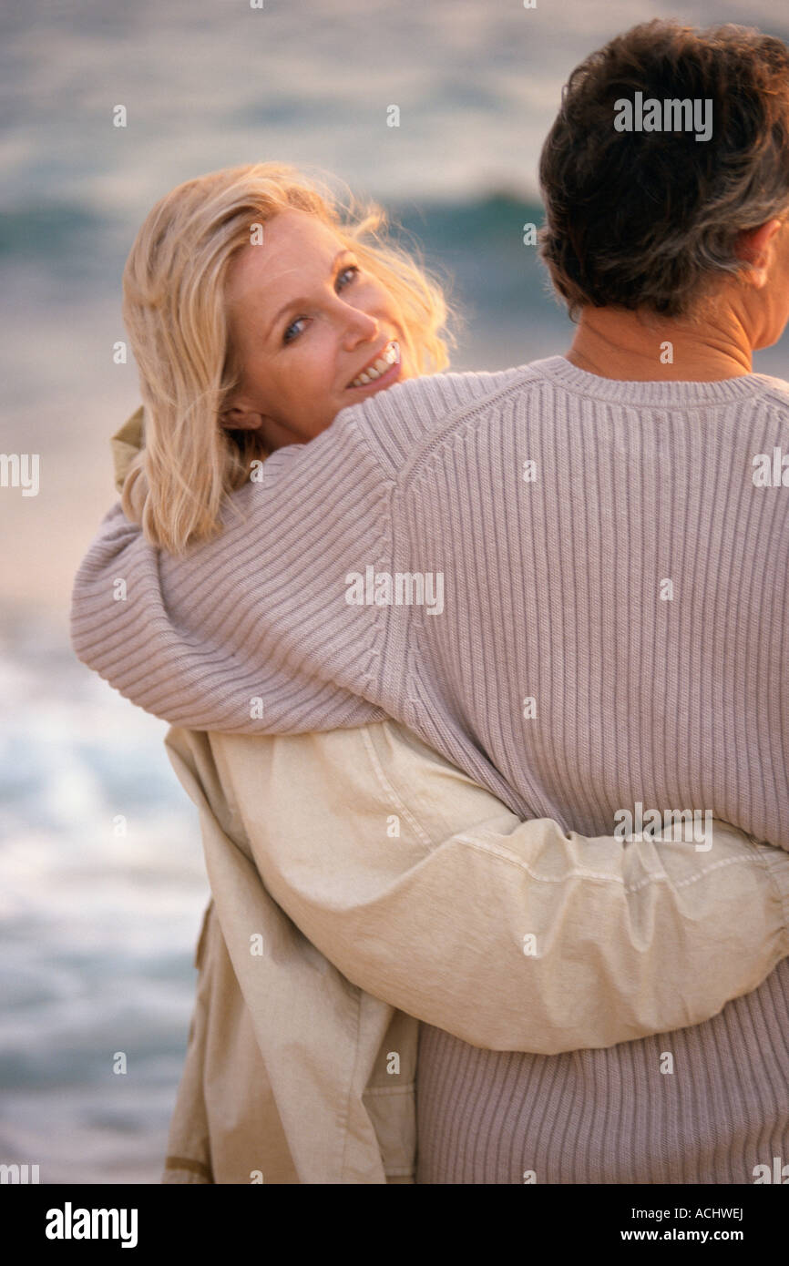 Portrait couple posing smiling view from the back Stock Photo - Alamy
