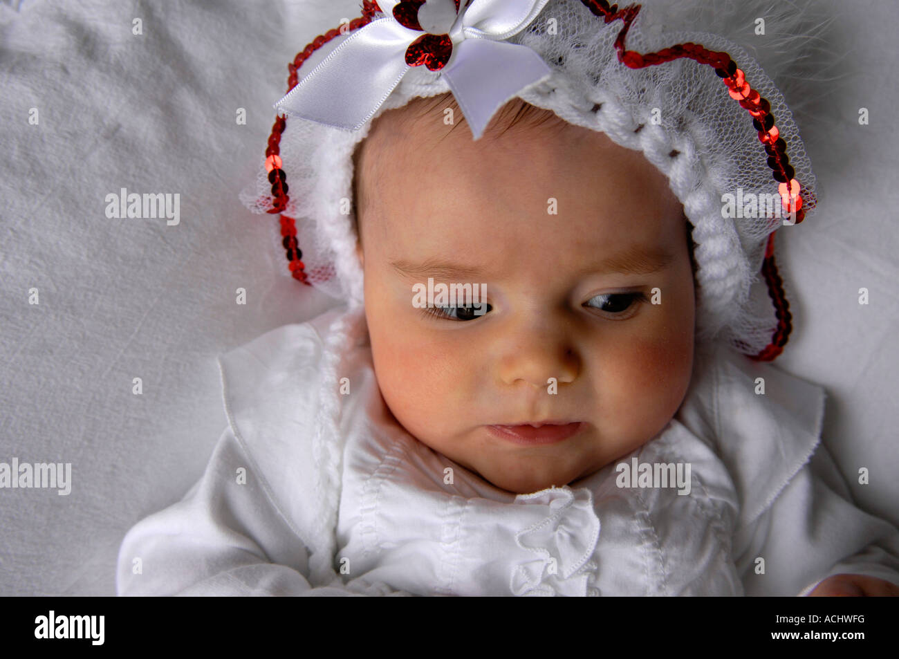 baby bonnet hat white red portrait face child infant colour color cute ...