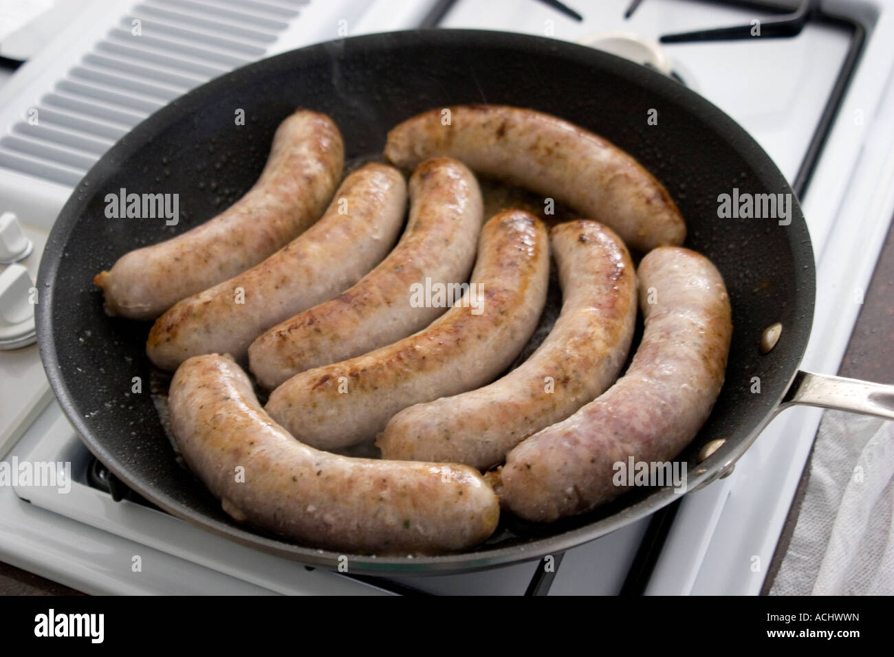 Sizzling sausages in frying pan hi-res stock photography and images - Alamy
