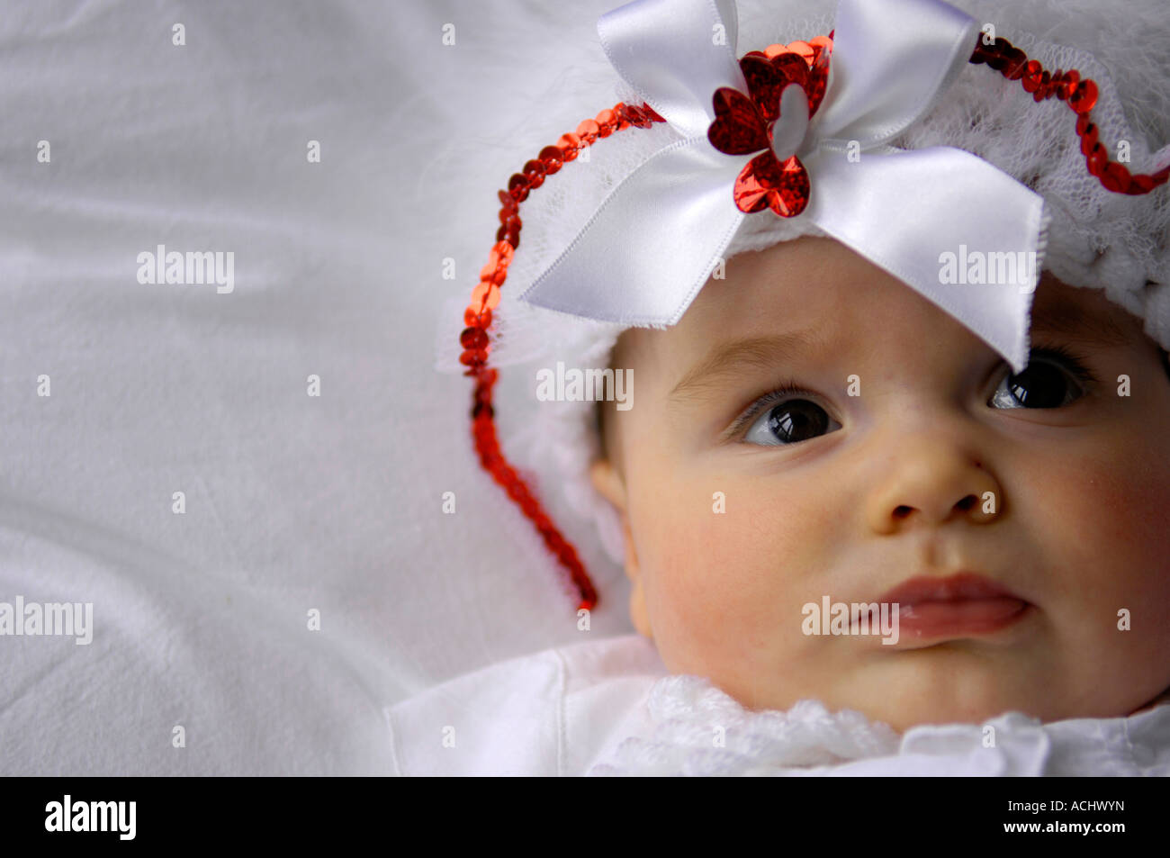 baby bonnet hat white red portrait face child infant colour color cute ...