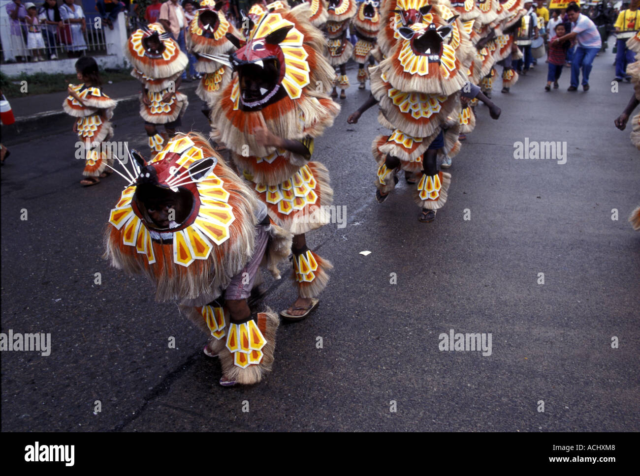 Philippines Dancers in black face and elaborate costumes at Ati Atihan ...