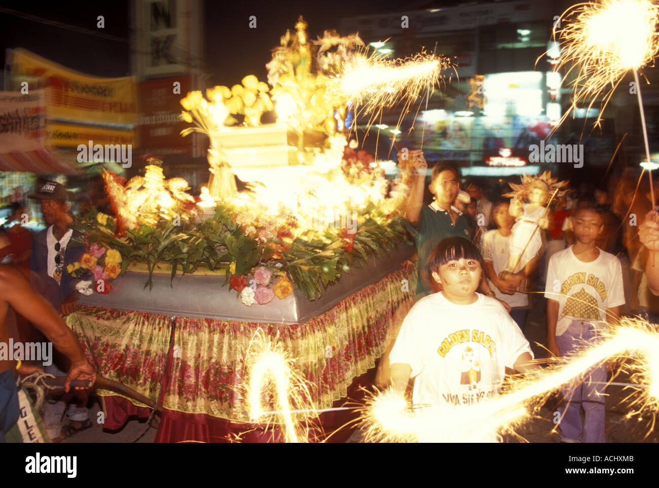 Philippines Celebrants with Santo Nin o float at parade at Ati Atihan ...