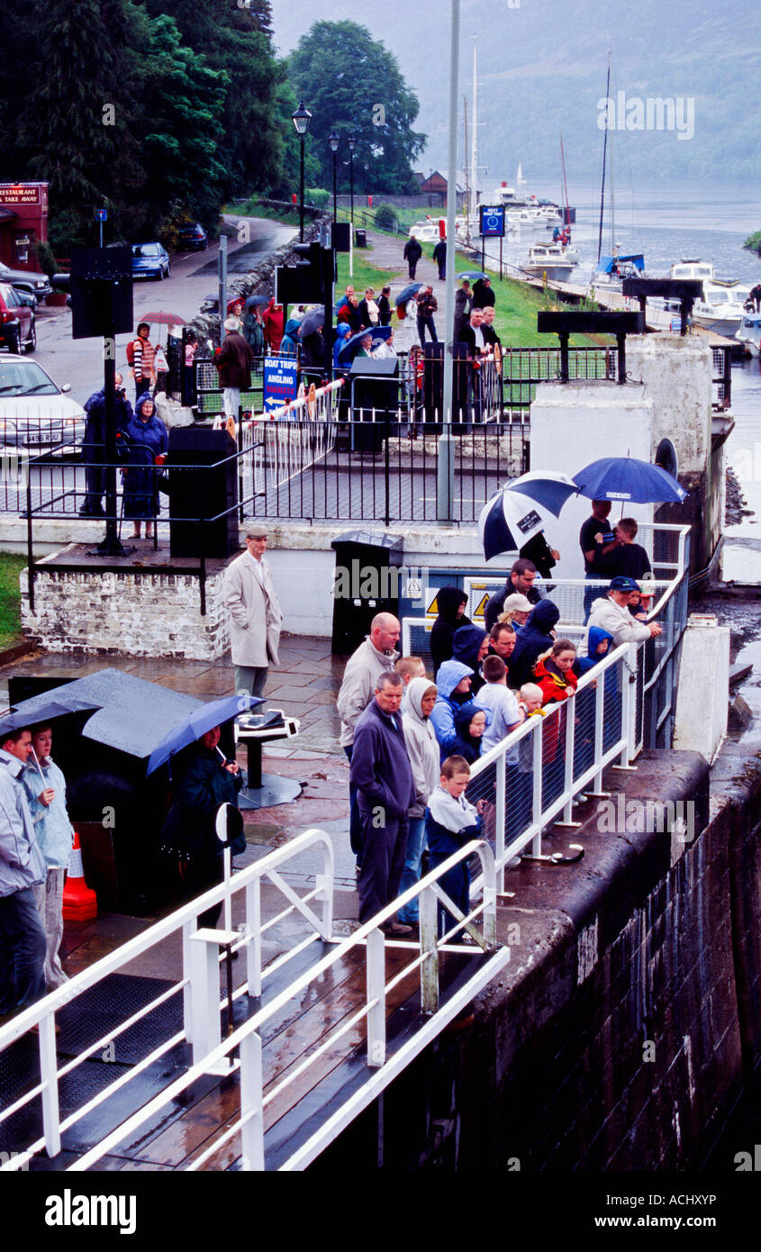 People watch the ship in the lock Stock Photo - Alamy