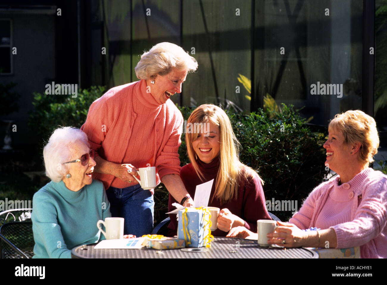 Colorful birthday party of authentic family portrait of four ...