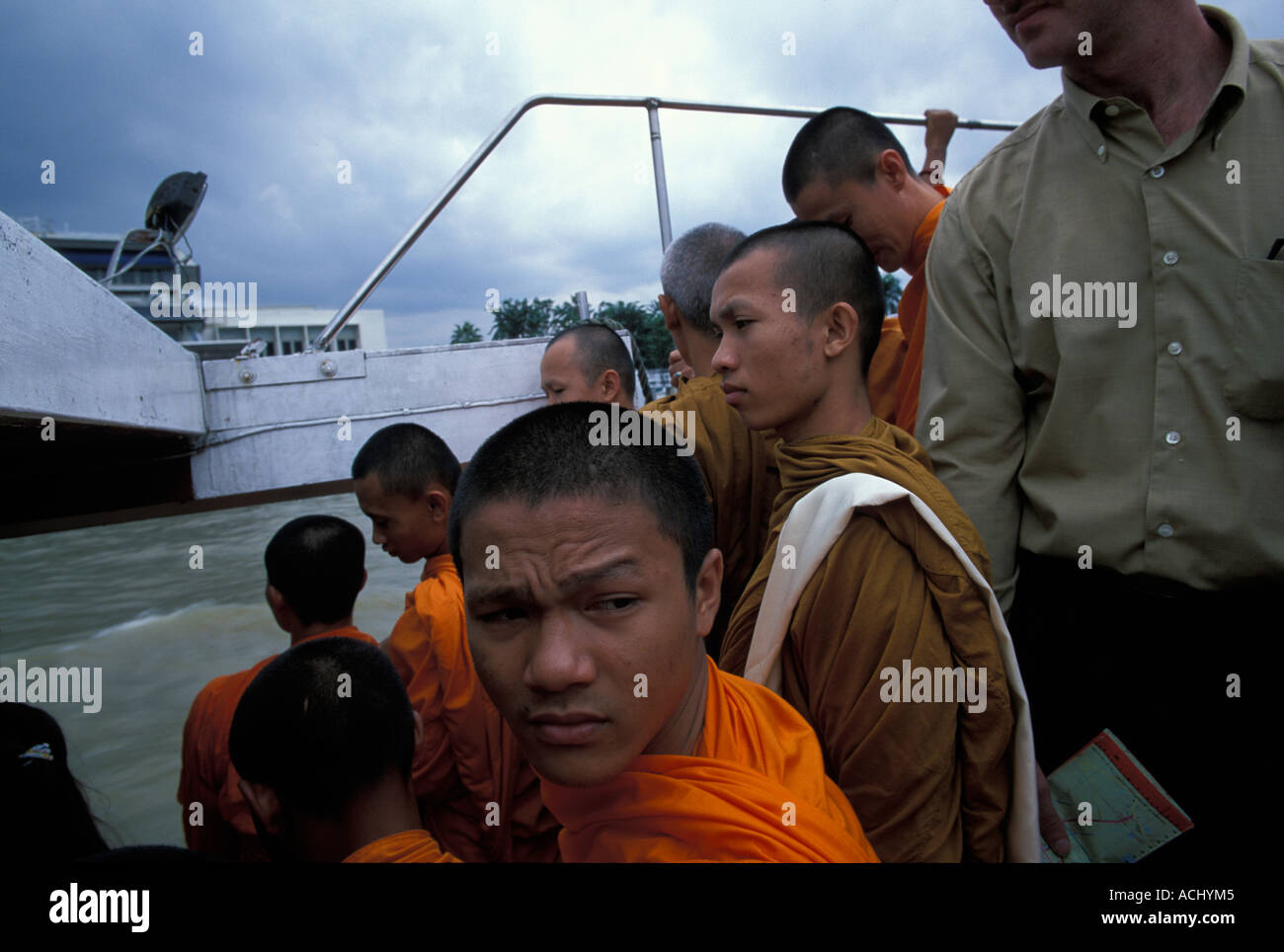Thailand Bangkok Buddhist monks crowd onto river ferry on Chao Praya ...