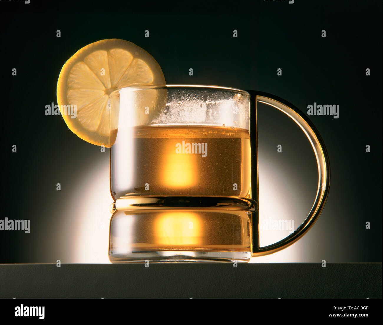 Grog glass slice of lemon black background Stock Photo - Alamy