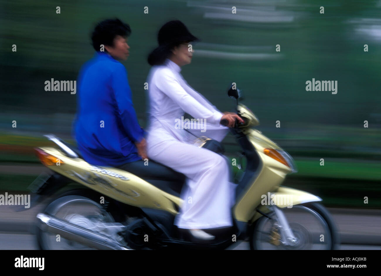 Asia Vietnam Hanoi Blurred image of motorcycle traveling around traffic ...