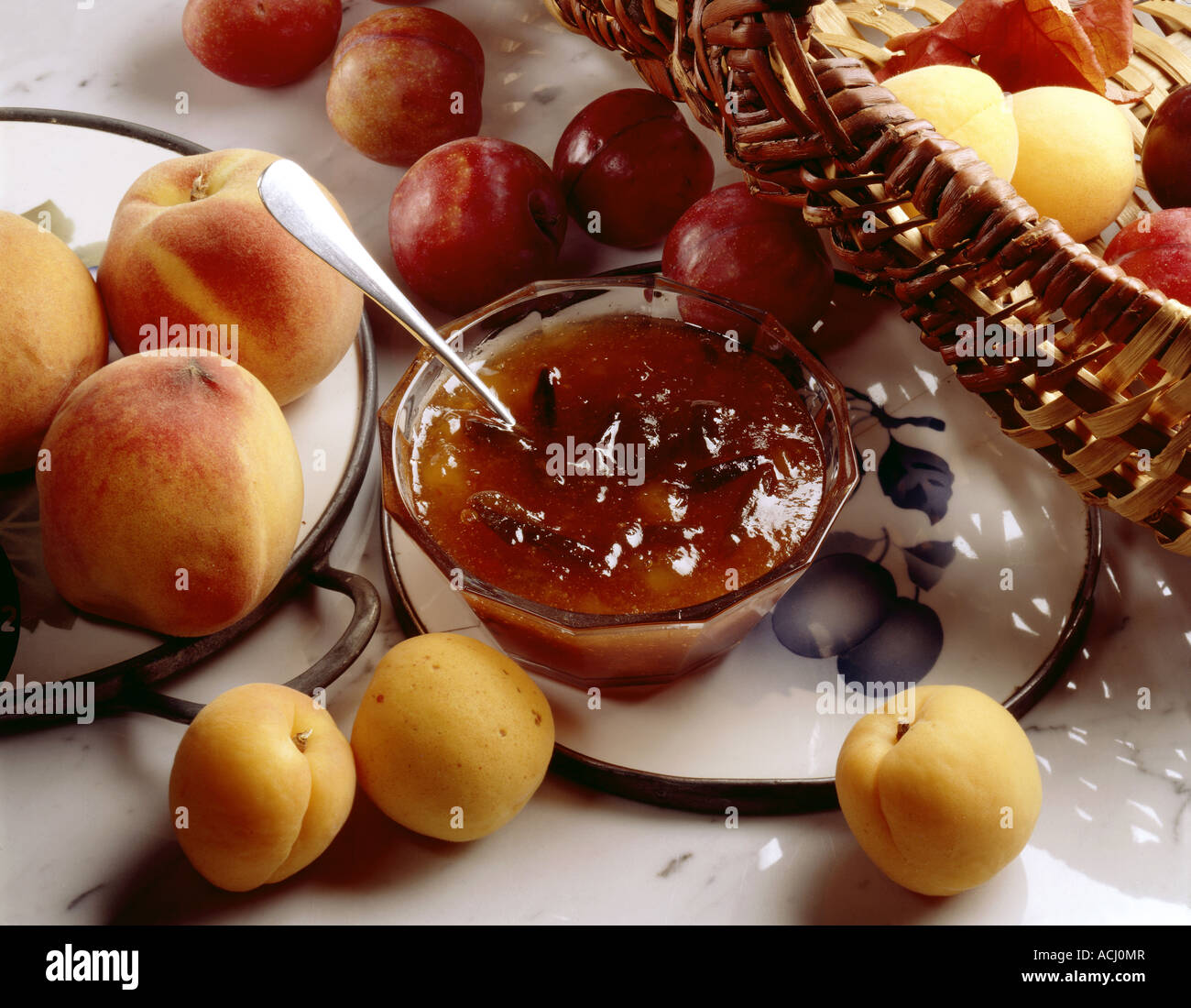Stone fruits jam in small dish fruit all around Stock Photo - Alamy