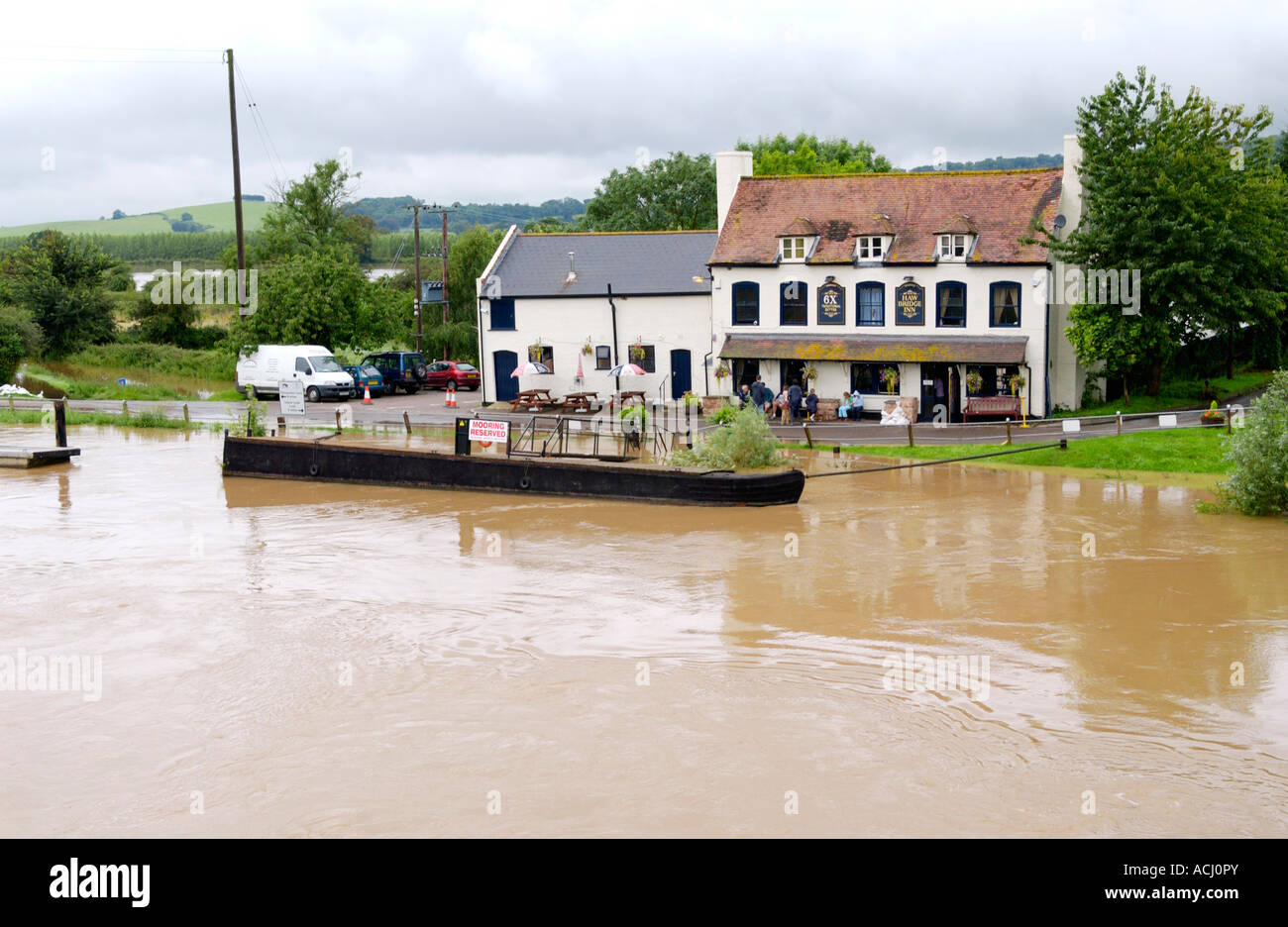 Haw Bridge Inn inches from being flooded on banks of River Severn ...