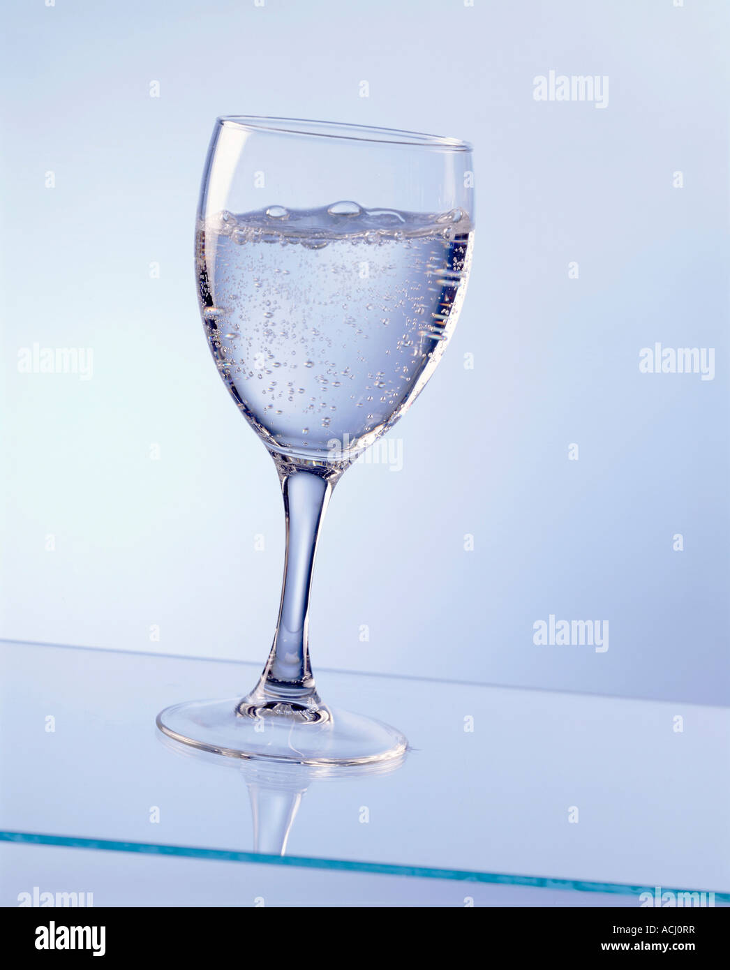 Glass of gas water white background Stock Photo - Alamy