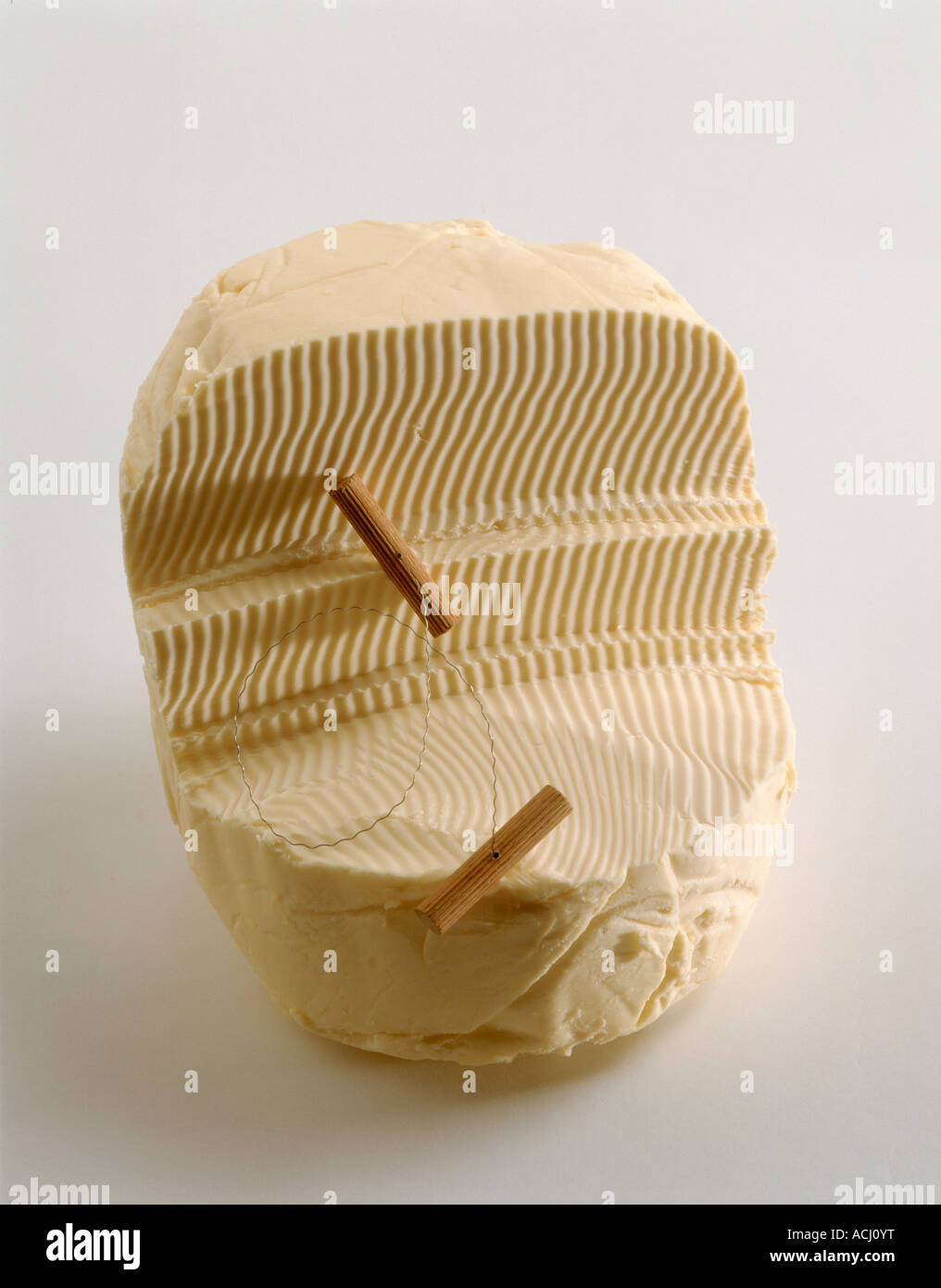 Close-up on pat of butter white background Stock Photo - Alamy