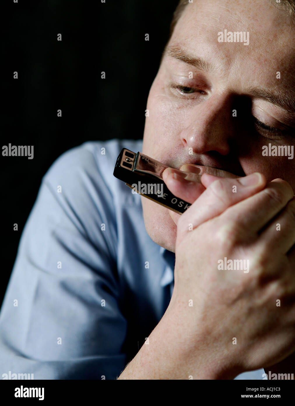 Harmonica man hi-res stock photography and images - Alamy
