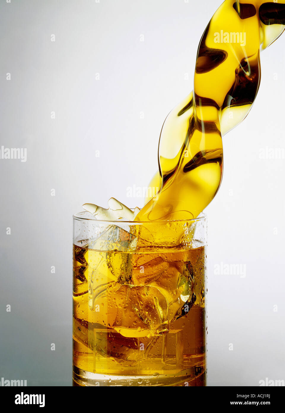 Alcohol going down on a glass Stock Photo - Alamy